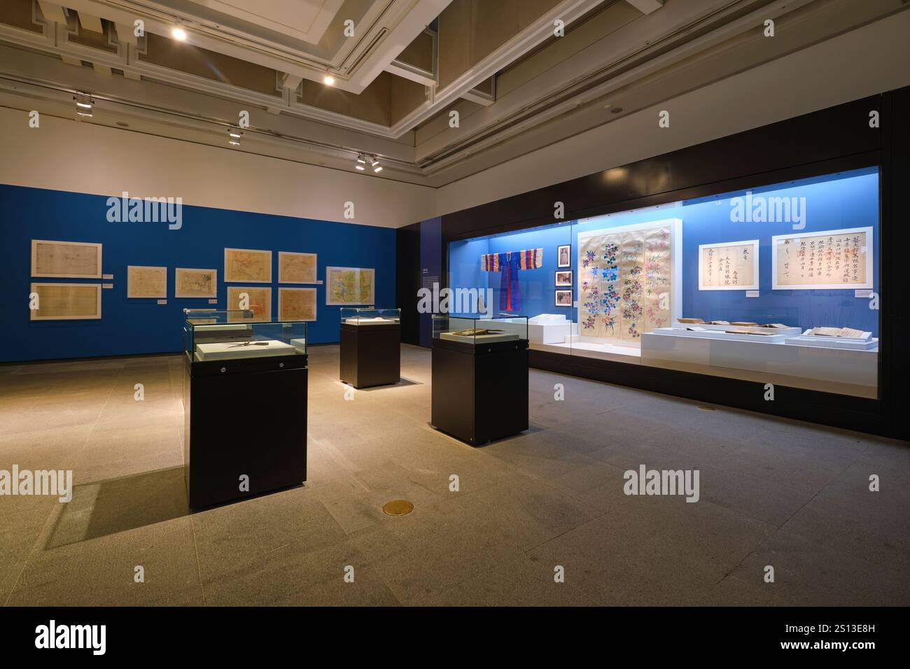 On display, old maps, a robe and calligraphy examples. A typical ...