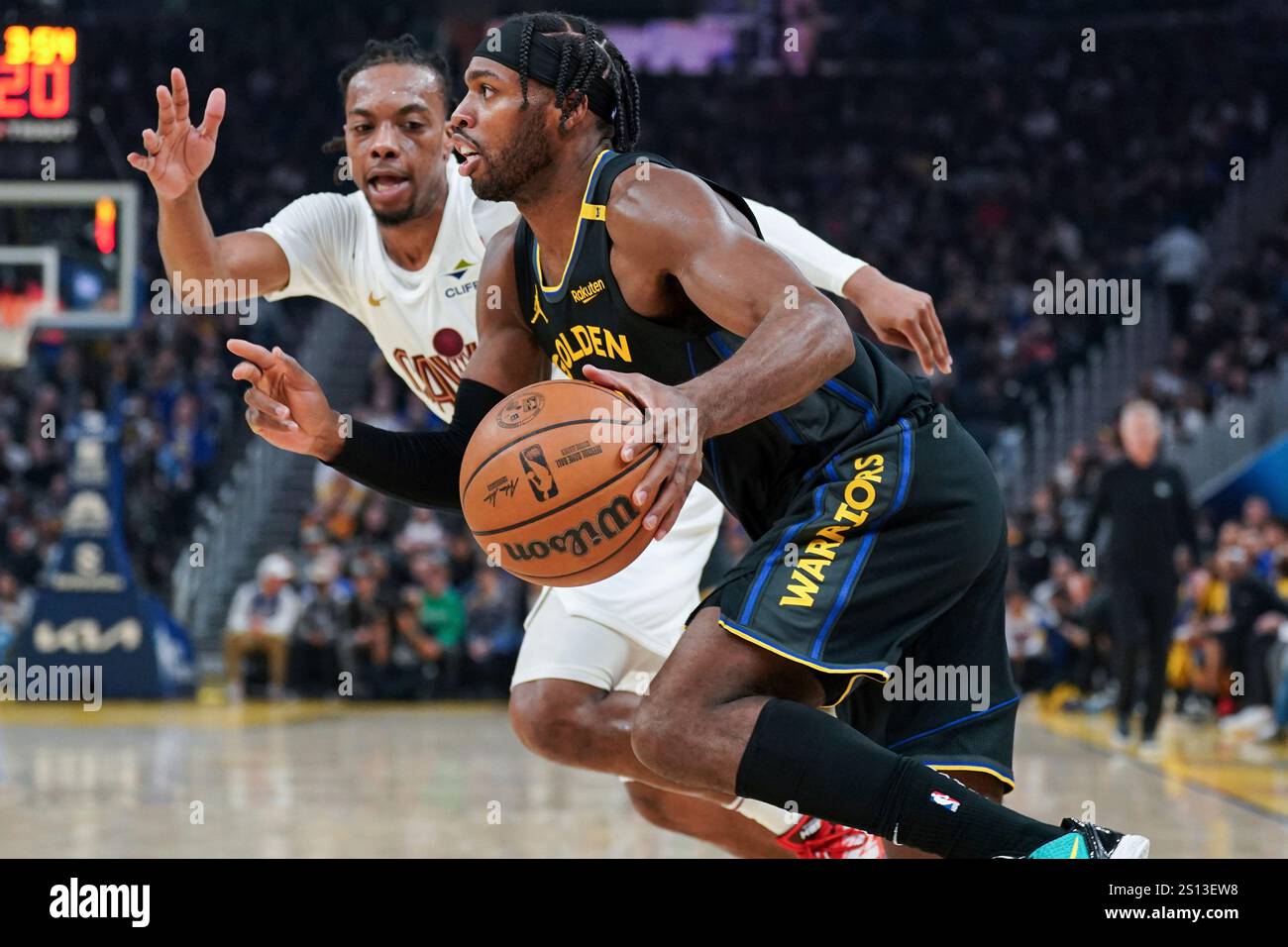 Golden State Warriors guard Buddy Hield, right, moves the ball while ...