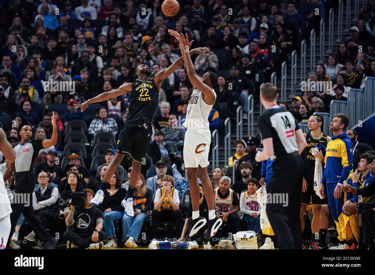Cleveland Cavaliers center Evan Mobley, right, shoots over Golden State ...