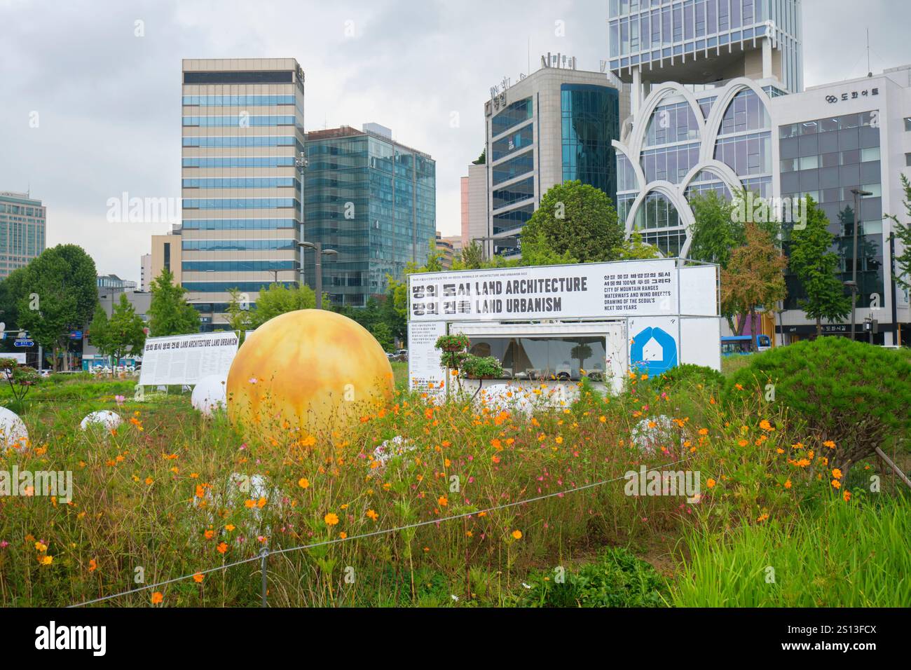the ticket booth and an orb within the park. At the temporary Land ...