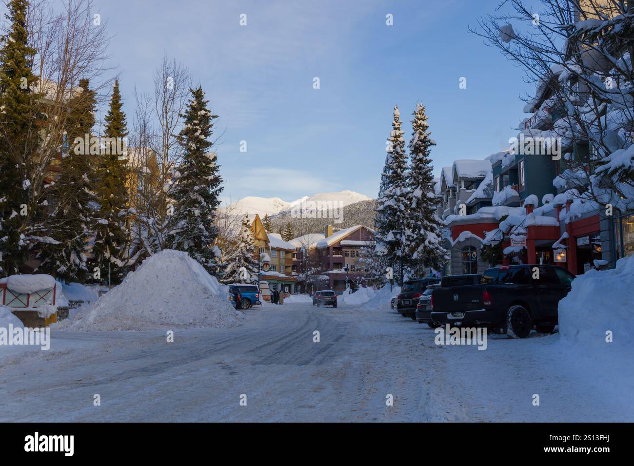 Snow plow tractor under piles of snow. After a blizzard - a transport ...