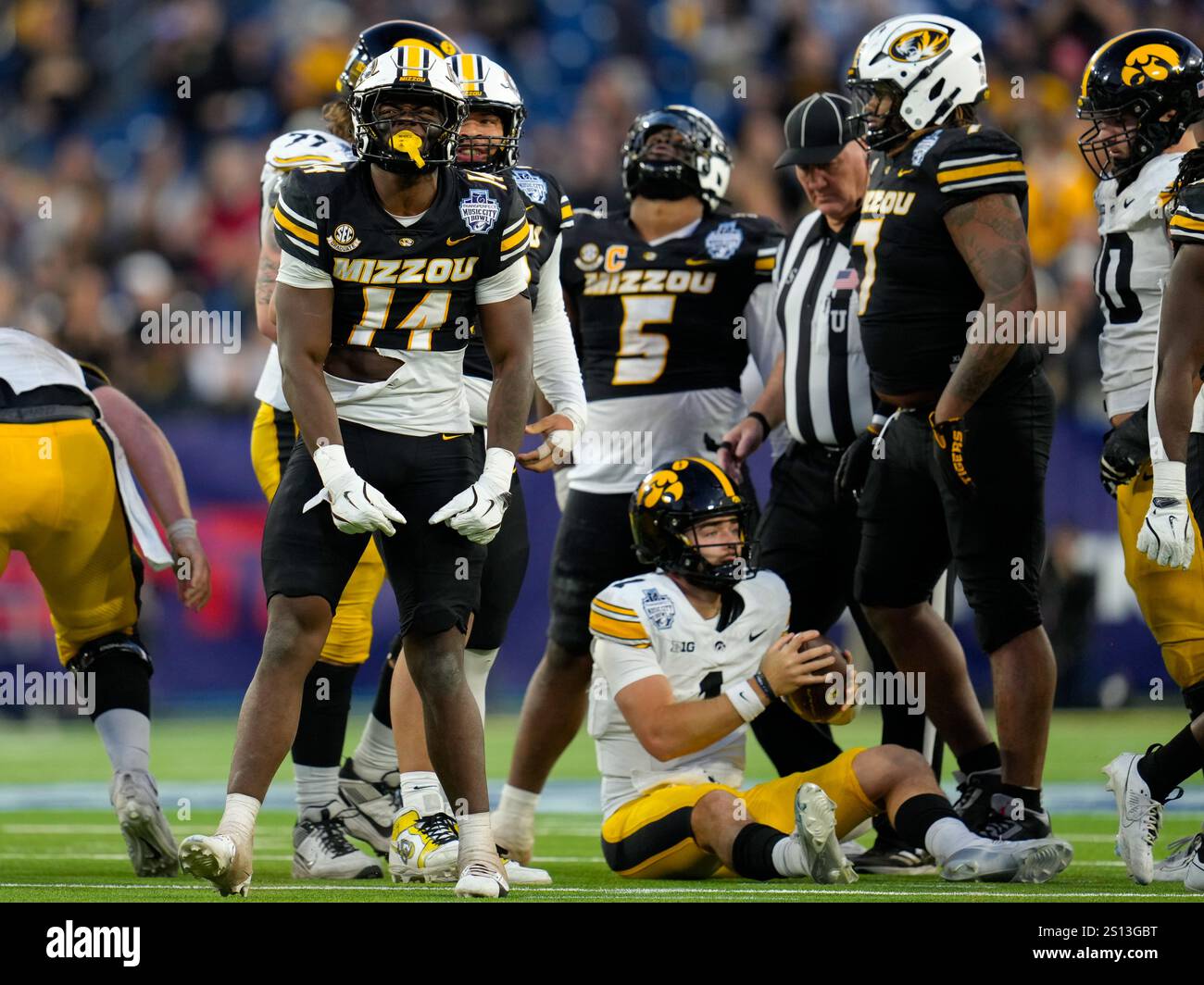Linebacker Triston Newson (Missouri Tigers, #14) reacts after a sack of ...