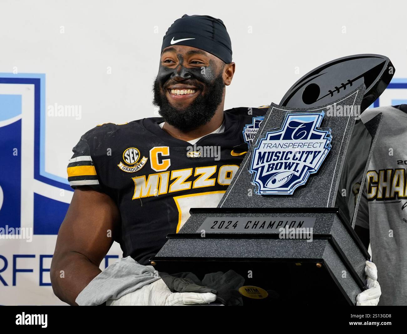 Defensive tackle Kristian Williams (Missouri Tigers, #05) holds the ...