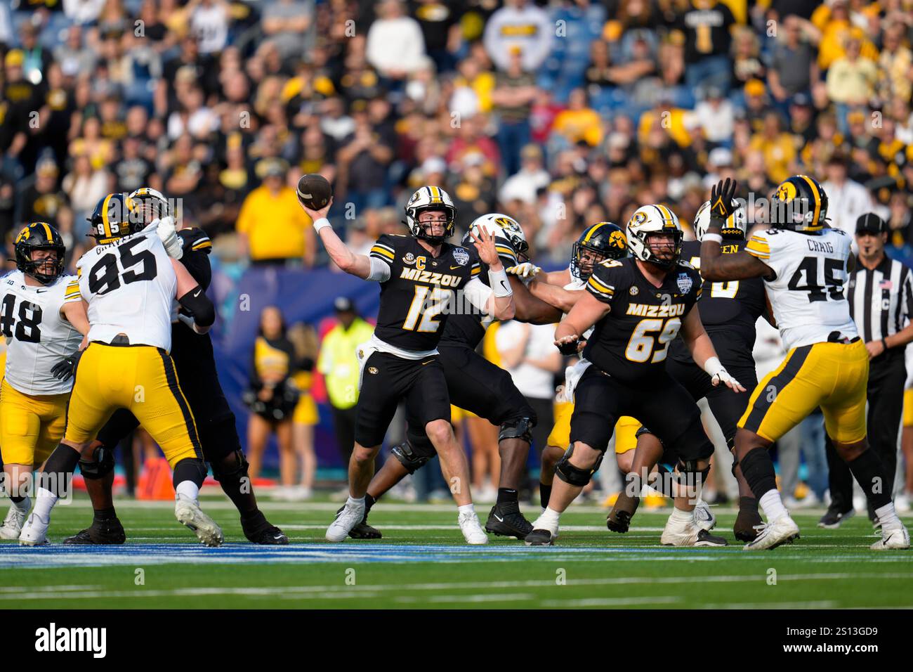 Quarterback Brady Cook (Missouri Tigers, #12) passes the ball for a ...