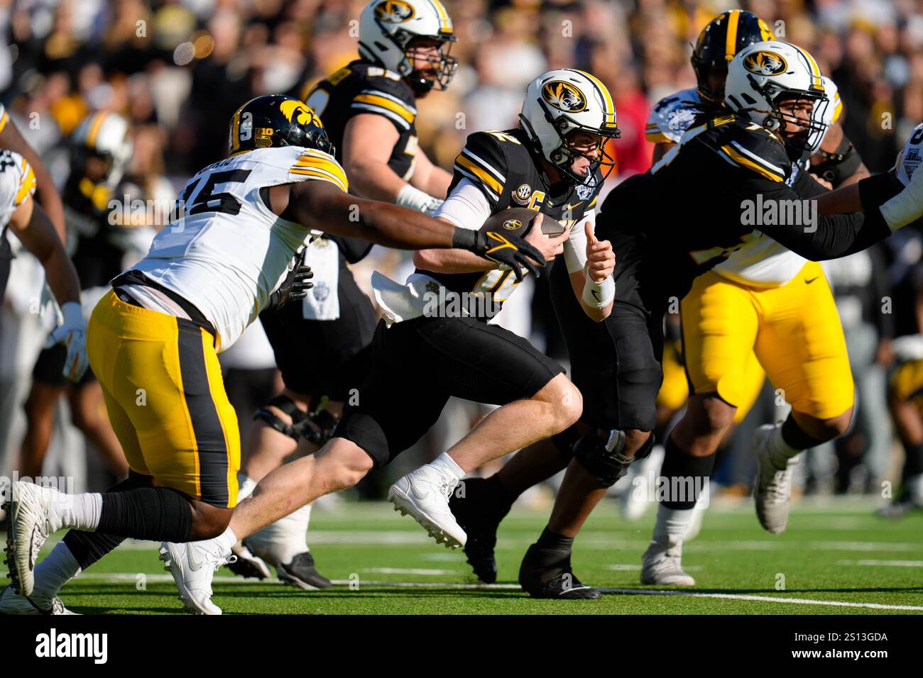 Defensive lineman Deontae Craig (Iowa Hawkeyes, #45) attempts to tackle ...