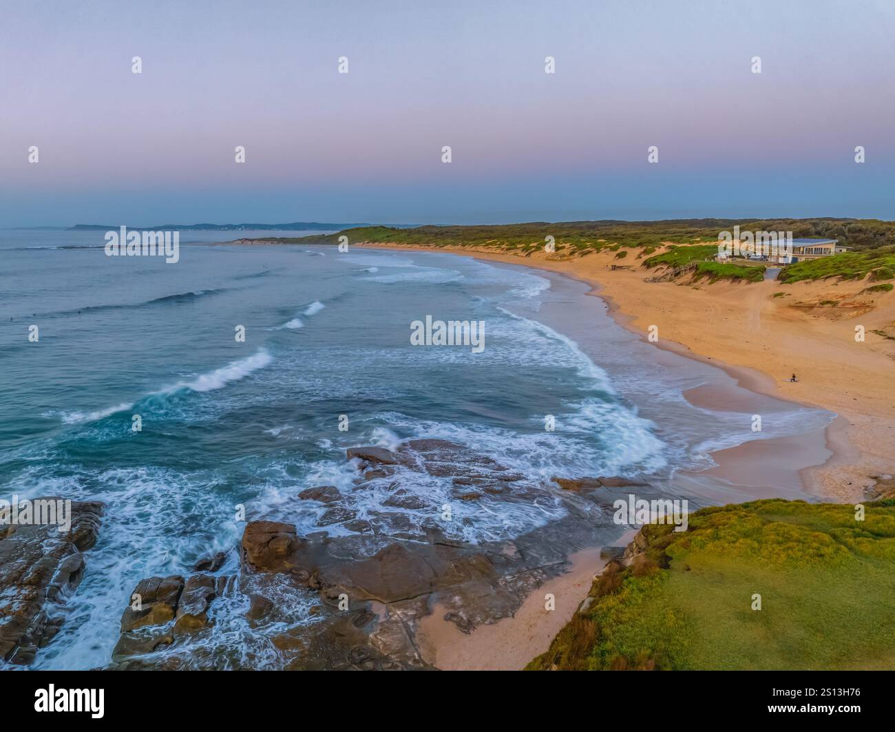 Aerial sunrise over the sea from Soldiers Beach at Norah Head, NSW ...