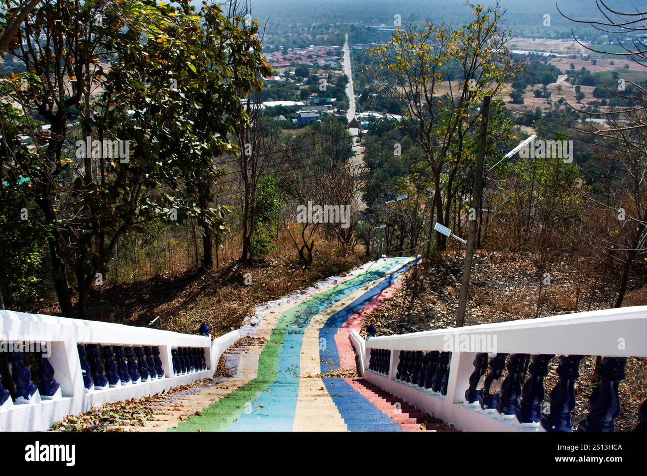 Step rainbow stairs in forest on mountain hill route walkway to top ...
