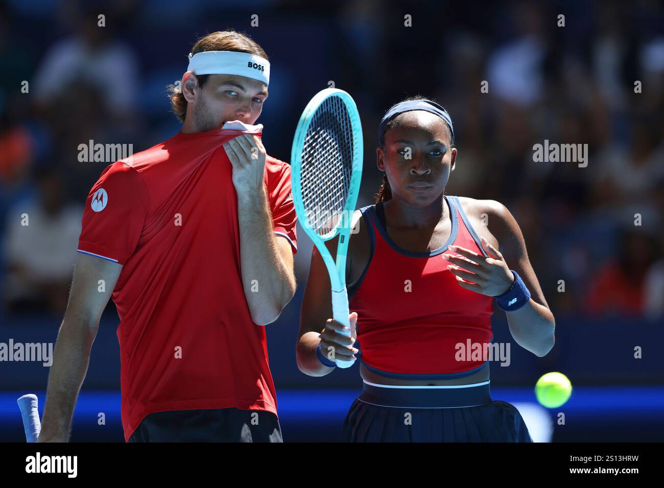 Taylor Fritz and Coco Gauff of the United States talk between point ...