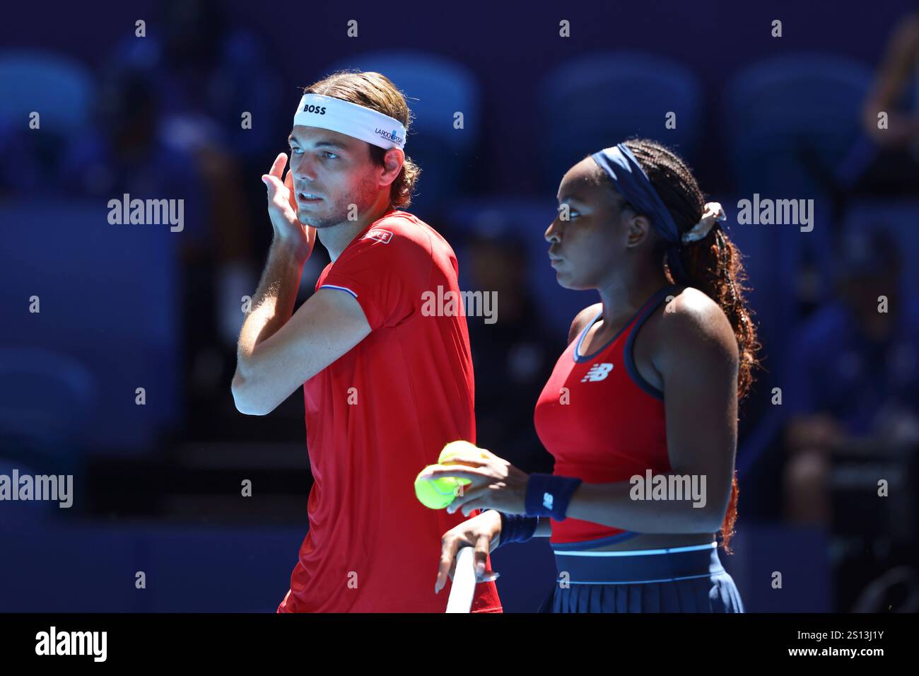 Taylor Fritz and Coco Gauff of the United States talk between point ...