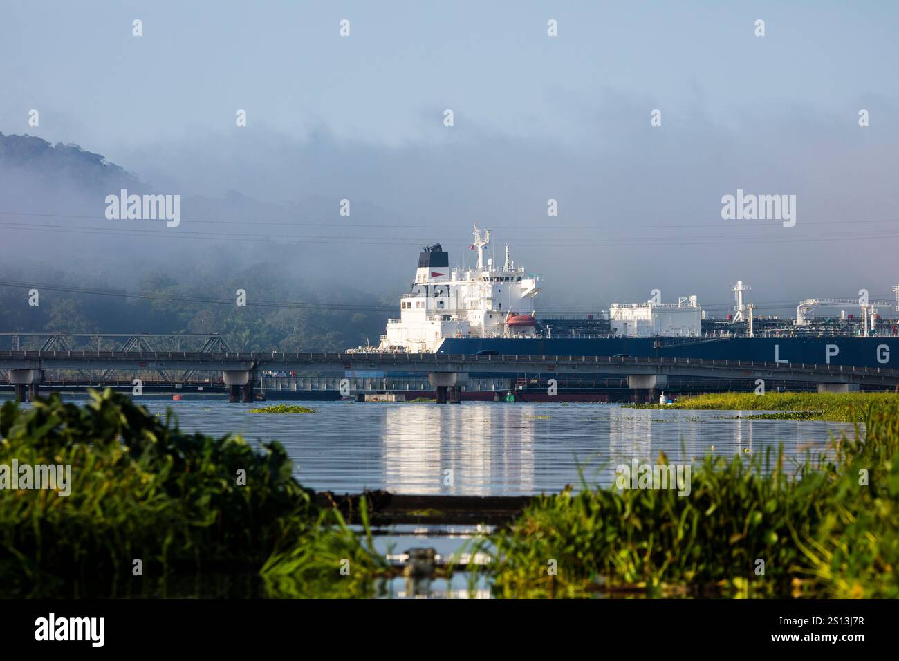 A LPG-vessel is passing through the Panama Canal on a misty morning, at ...