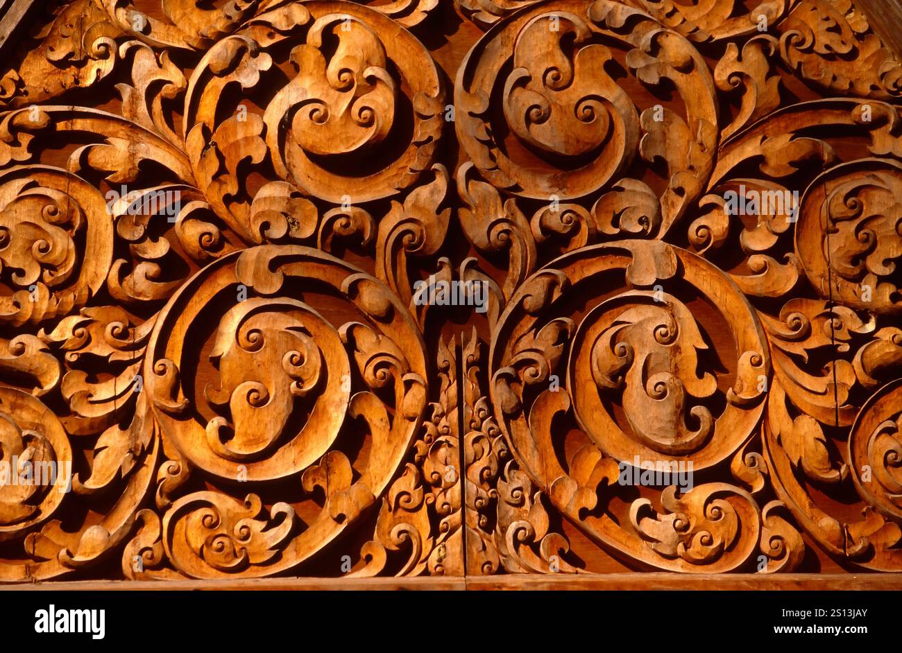 Traditional ornate Thai carving detail motif background carved on teak ...