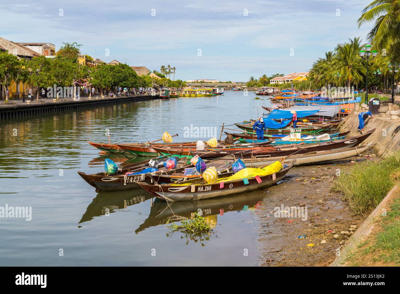 traditional wooden Vietnamese fishing boats on the Thu Bon River at Hoi ...