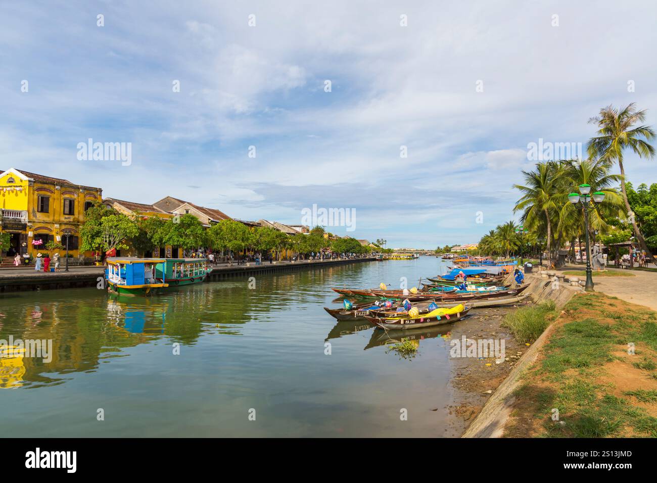 traditional wooden Vietnamese fishing boats on the Thu Bon River at Hoi ...