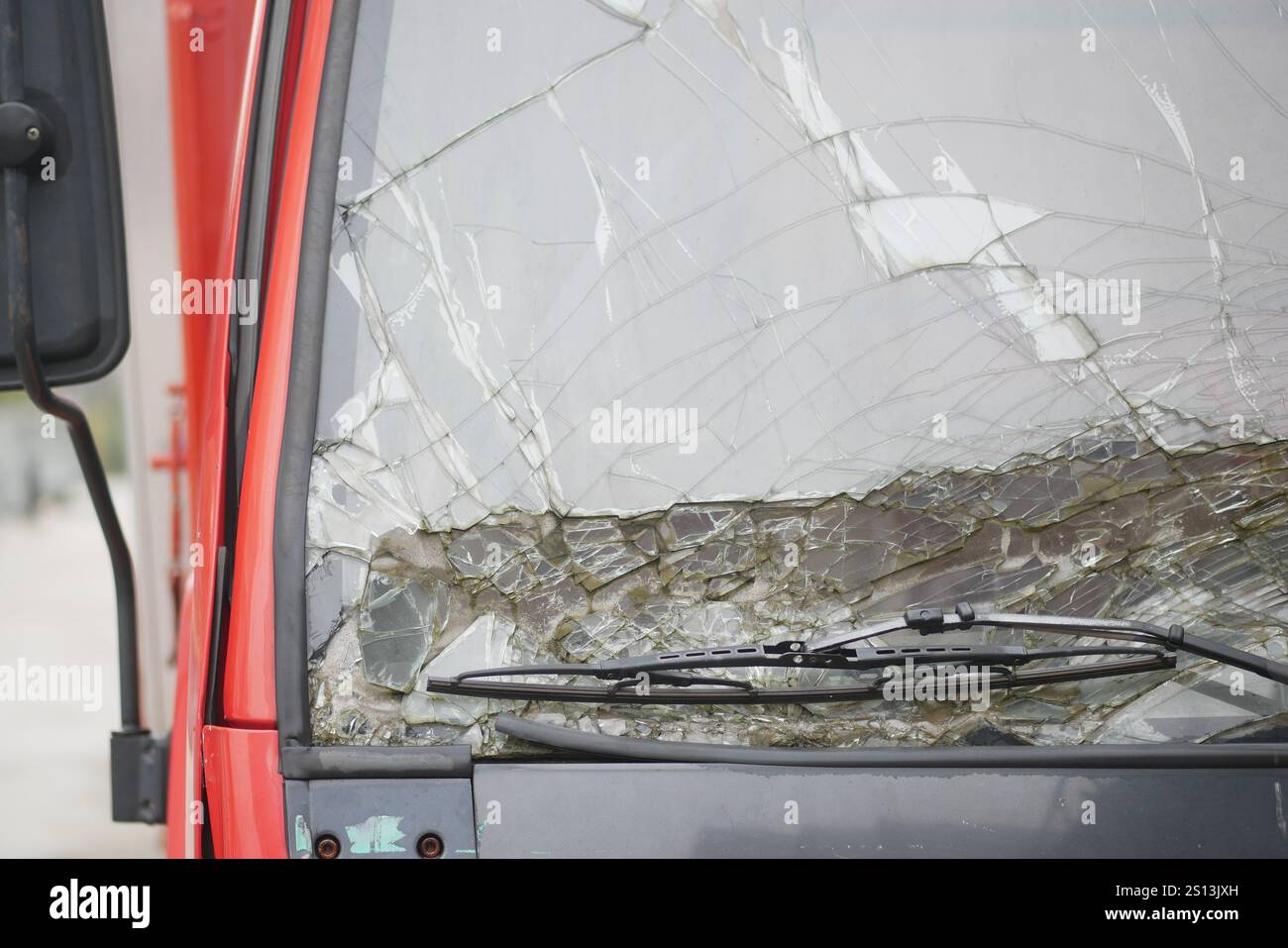 Cracked Windshield of a Red Vehicle Depicting Damage and Repair Needs ...