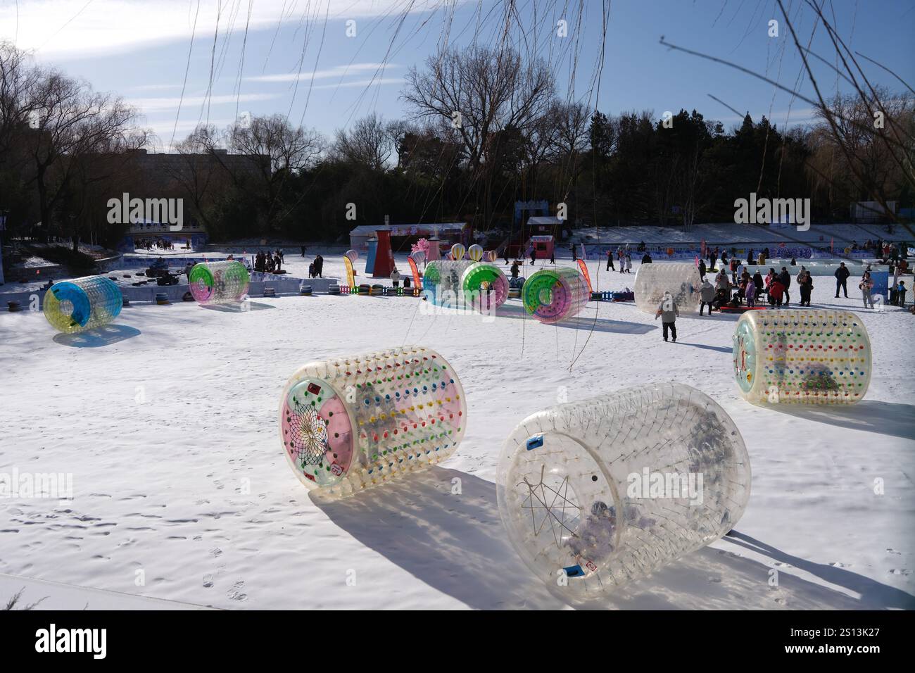 Tourists experience ice and snow sports at a park in Beijing, China, 27 ...