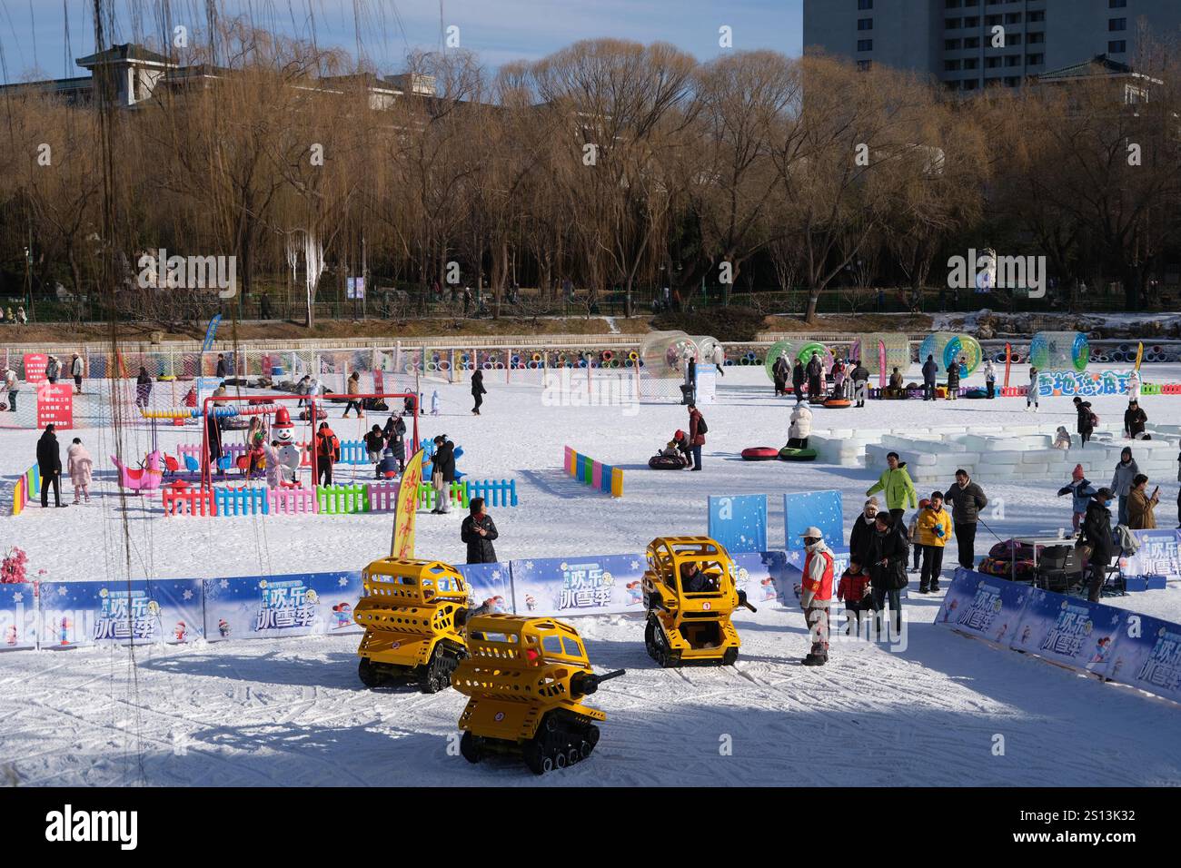 Tourists experience ice and snow sports at a park in Beijing, China, 27 ...