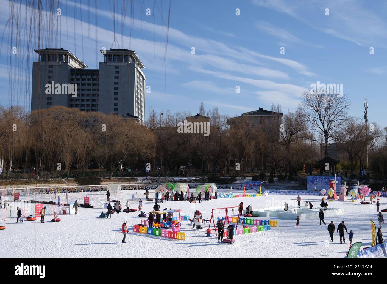 Tourists experience ice and snow sports at a park in Beijing, China, 27 ...