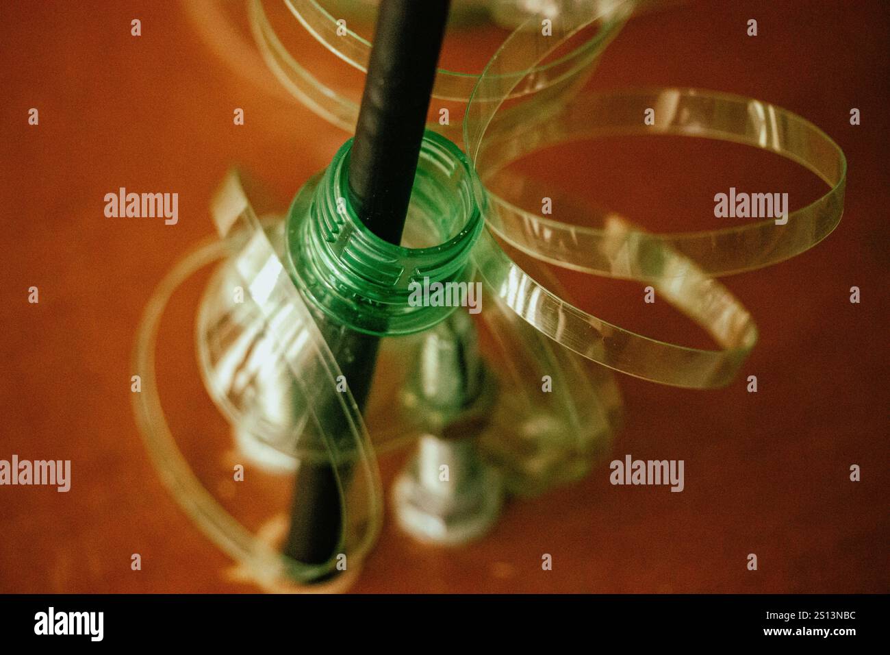 Recycling green plastic bottle to be reused for manufacturing. New life ...