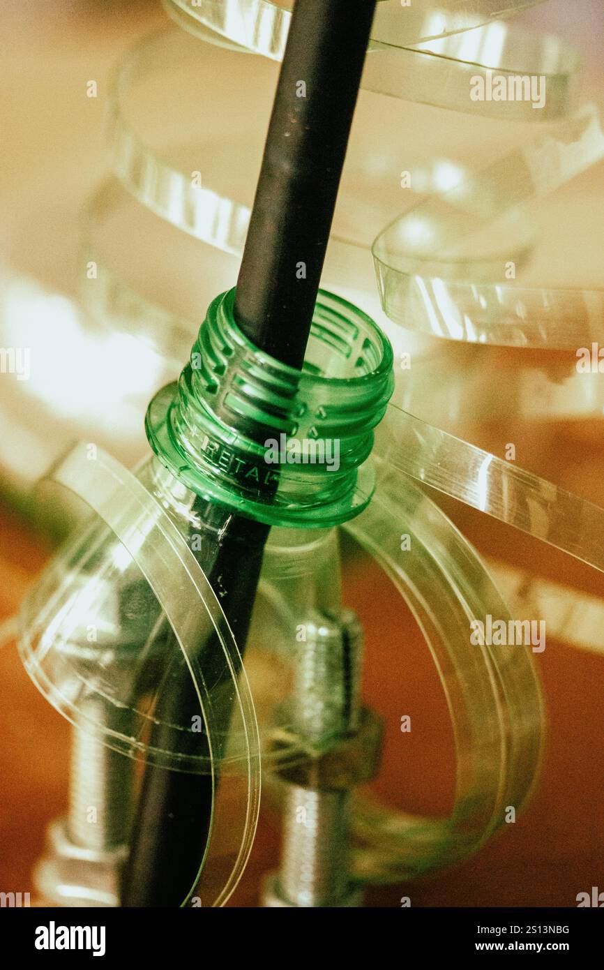 Recycling green plastic bottle to be reused for manufacturing. New life ...