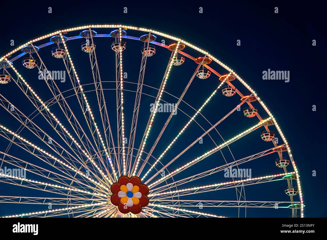 Ferris Wheel At Night Time With Vivid Lights Stock Photo - Alamy