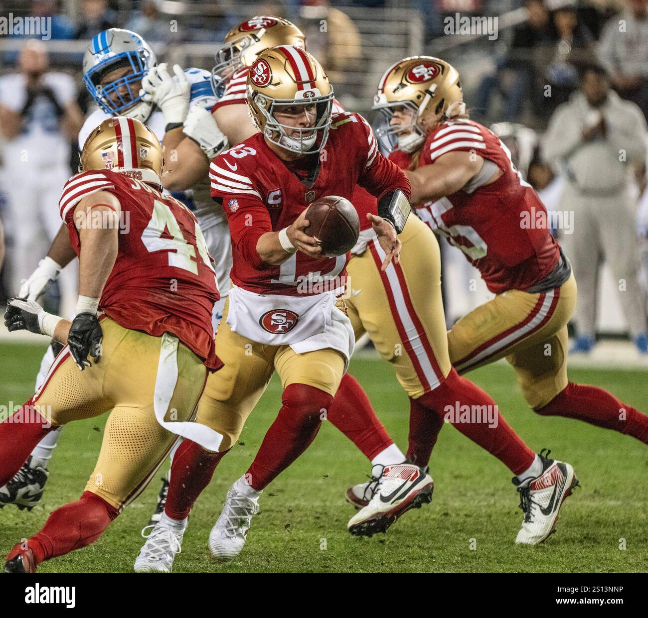 San Francisco 49ers quarterback Brock Purdy (13) looks to handoff the ...