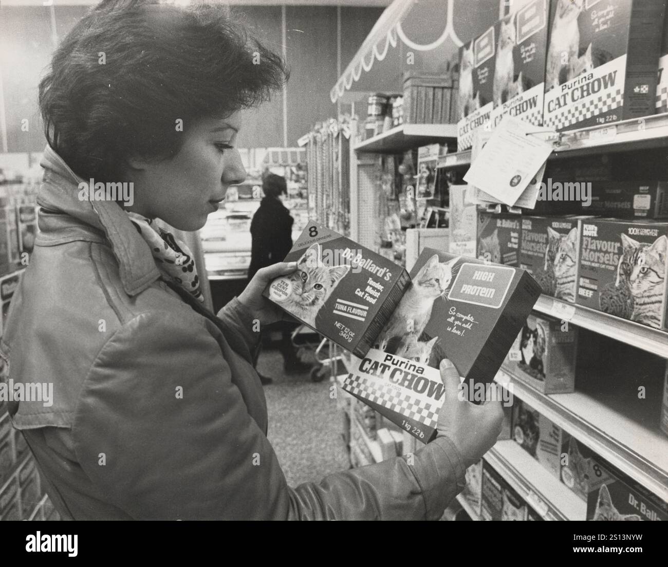 A Toronto shopper studies metric packaging on pet food in Toronto ...
