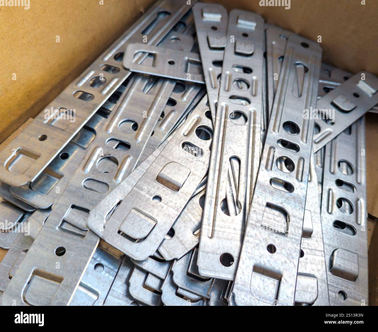 Mounting plates for fixing window frames in the window opening Stock ...