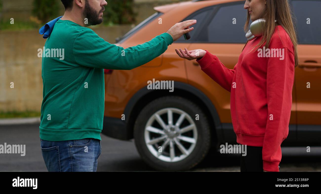 Car keys handshake, seller or car salesman and customer in a dealership ...