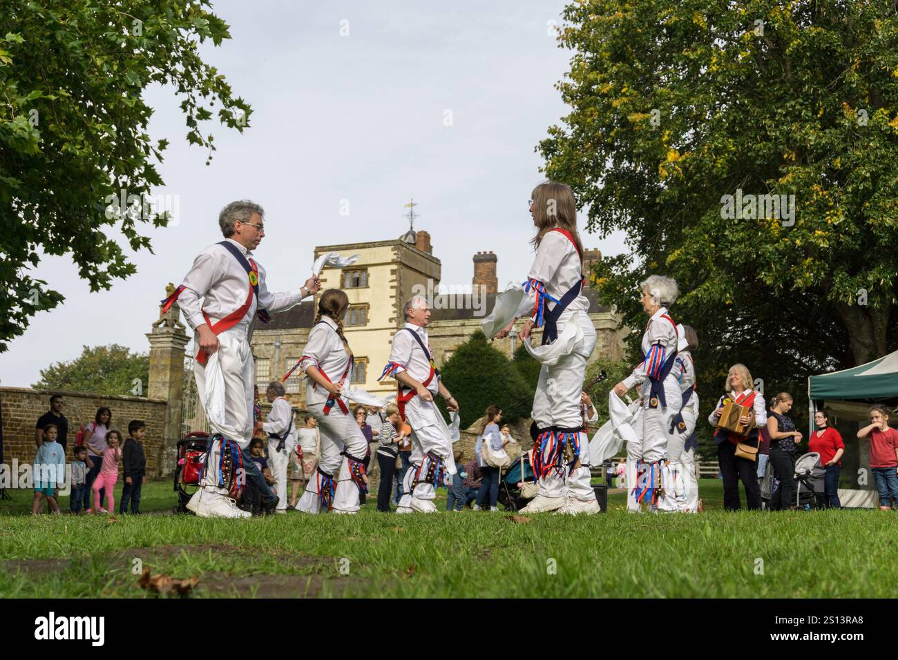 Men and women Morris Dancers performing at a country fair, Canons Ashby ...