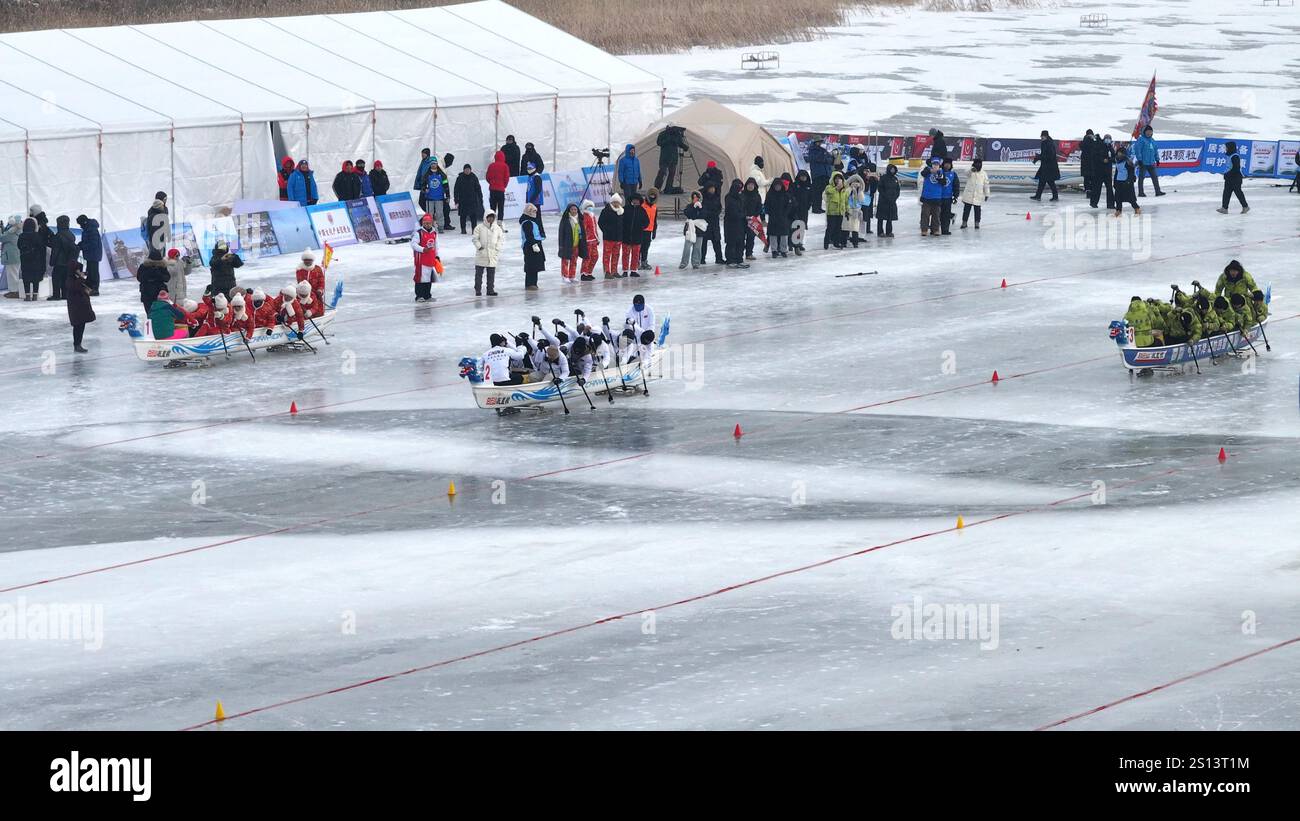 An ice dragon boat race at Hulan Estuary Wetland Park draws tourists in ...