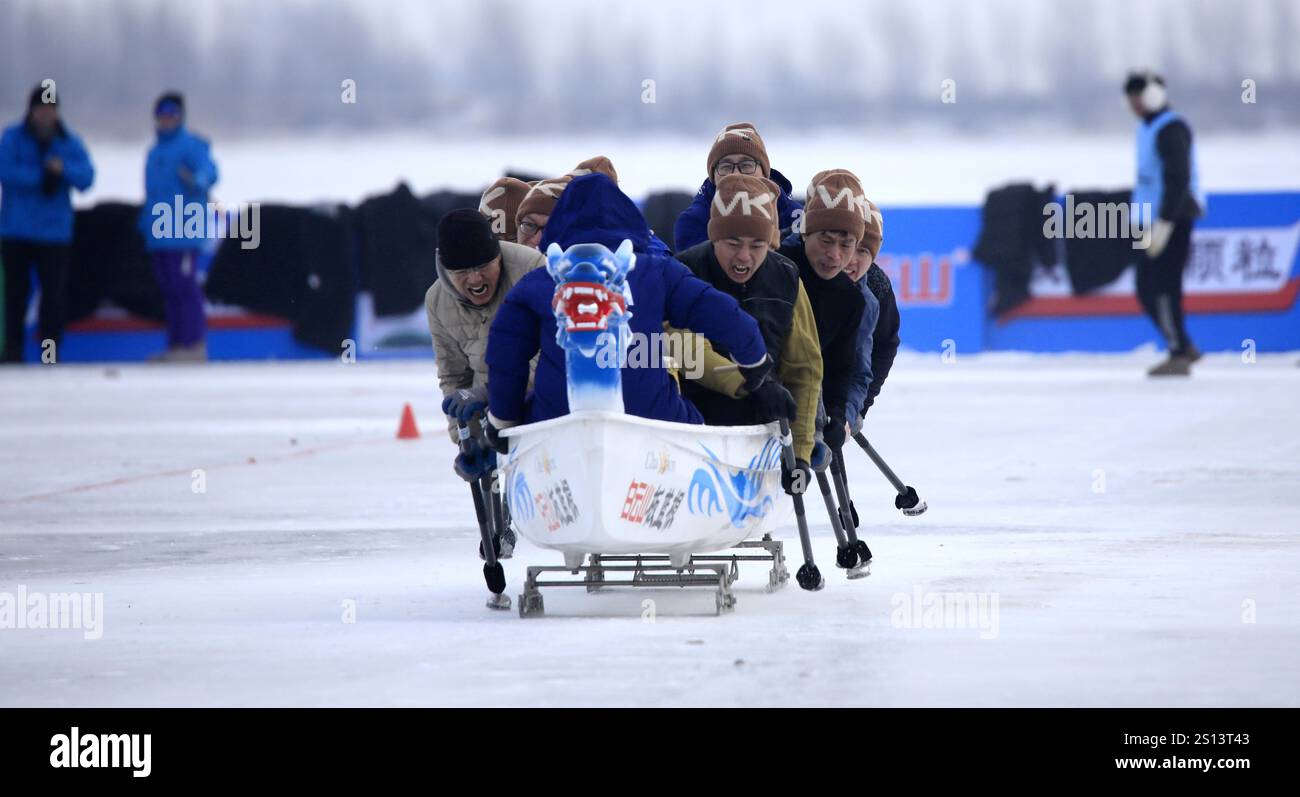 An ice dragon boat race at Hulan Estuary Wetland Park draws tourists in ...