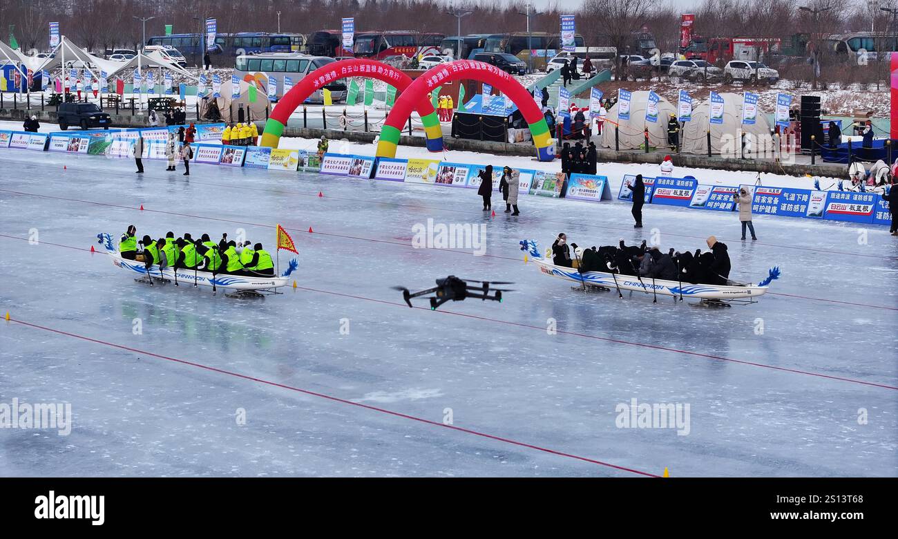 An ice dragon boat race at Hulan Estuary Wetland Park draws tourists in ...