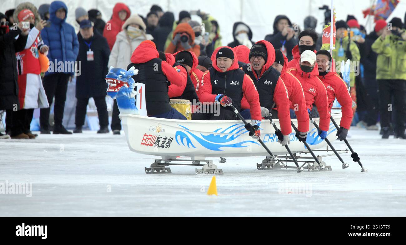 An ice dragon boat race at Hulan Estuary Wetland Park draws tourists in ...