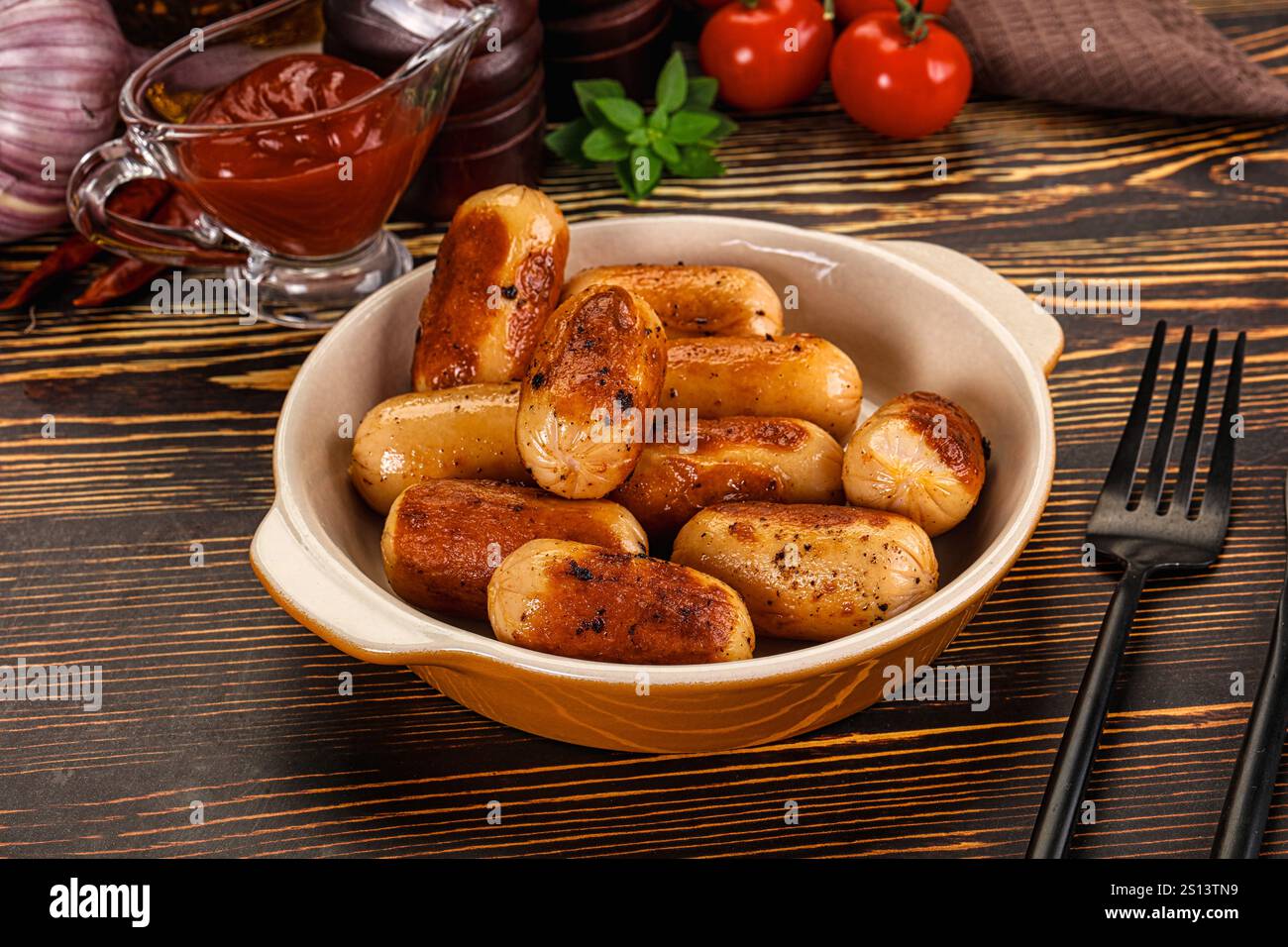 Roasted chicken mini sausages for breakfast in the bowl Stock Photo - Alamy