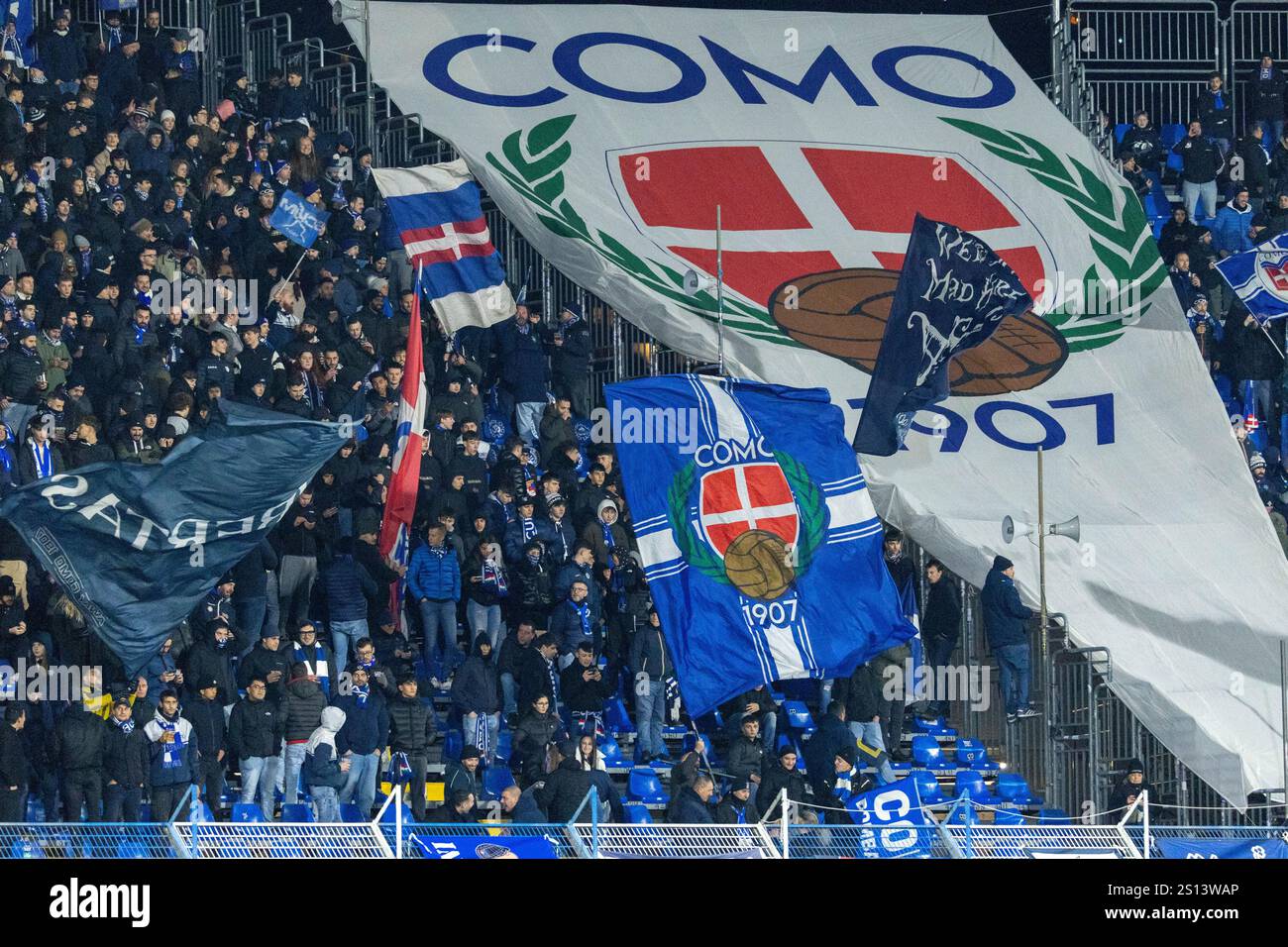 Como, Italy. 30th Dec, 2024. Como supporters supporting team during ...