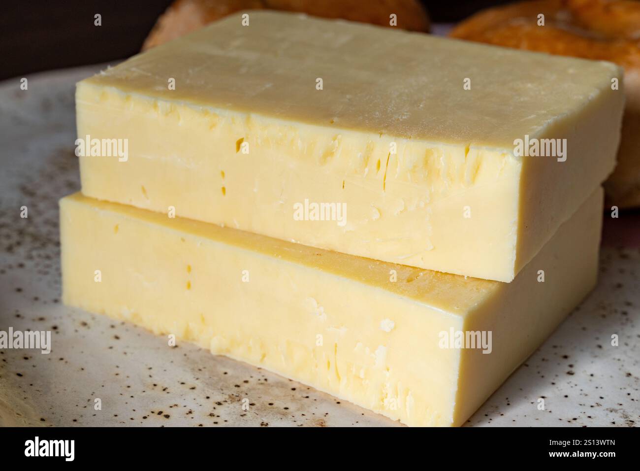 Block of aged cheddar cheese, the most popular type of cheese in United ...