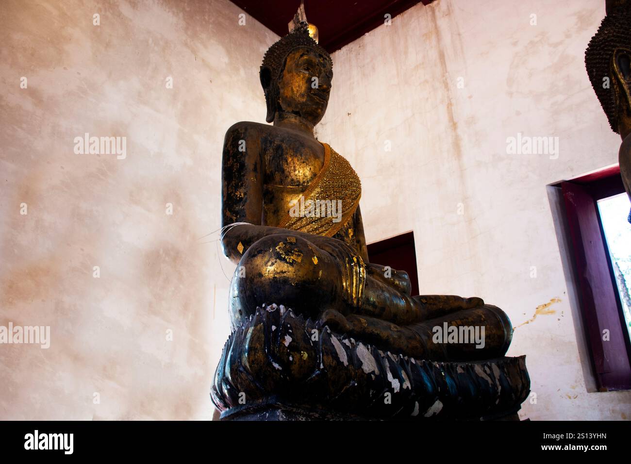 Holy ancient buddha statue Phra Phutta Rattana Munee in antique ubosot ...