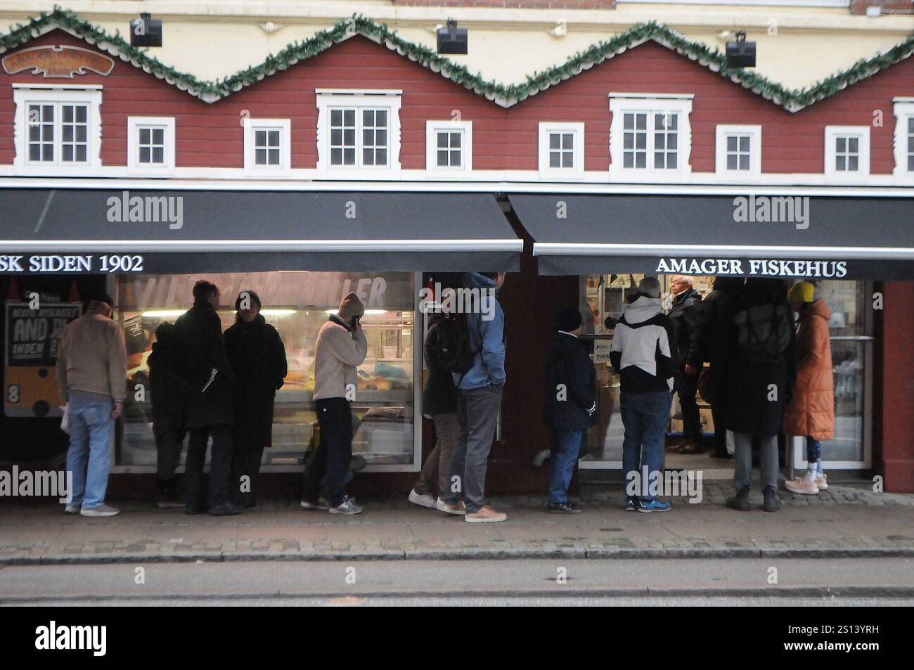 Copenhagen/ DenmarK/30 DECEMBER 2024/Danes waiting at fish shop in ...
