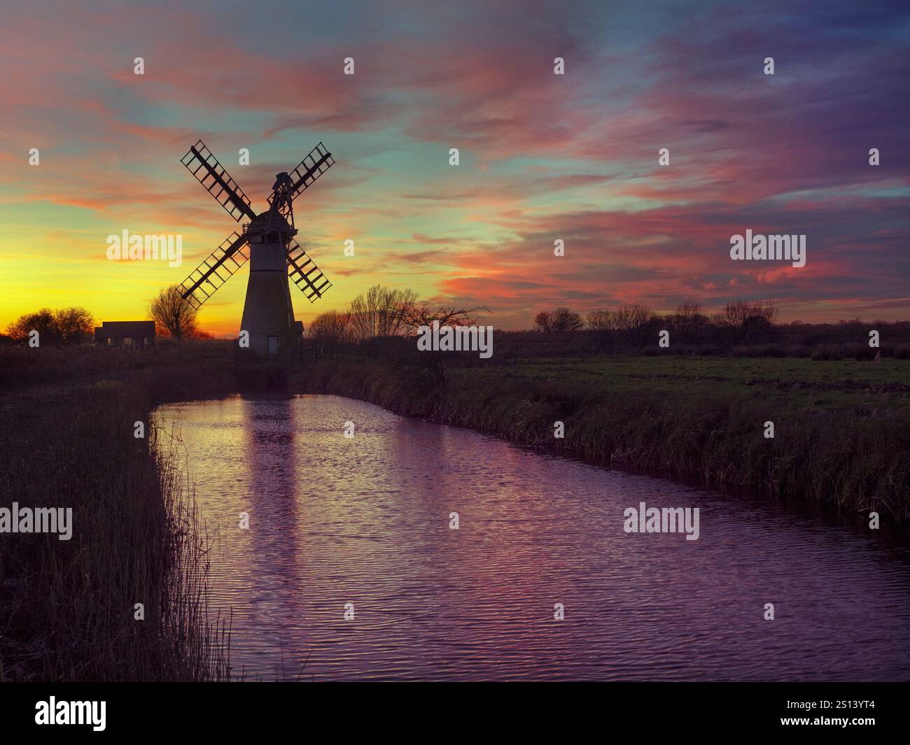 Thurne Windmill on the River Thurne at Sunset Norfolk Broads in winter ...