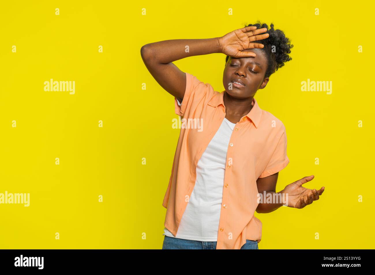 African American woman holds head swaying unsteadily with a disoriented ...