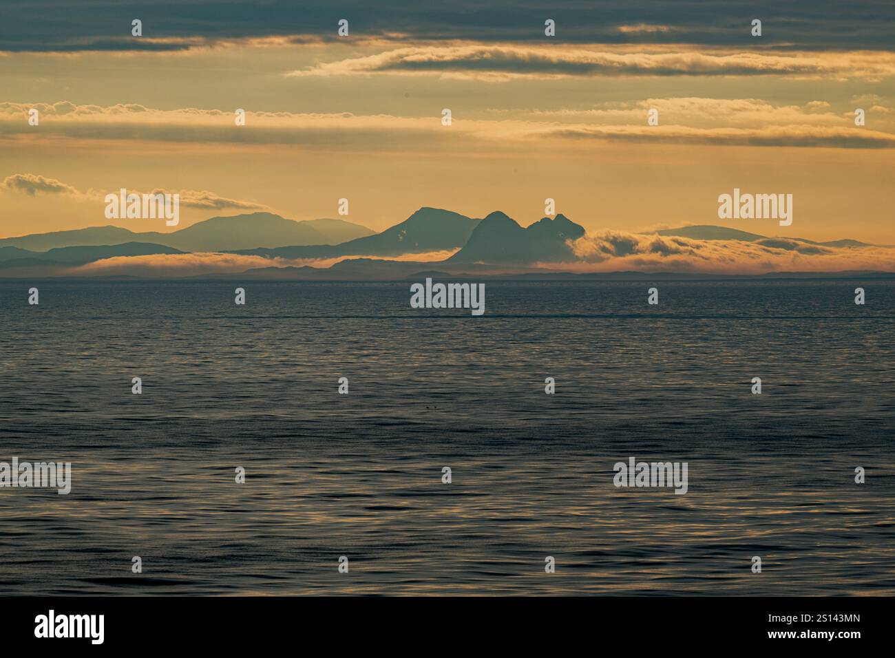 Sunrise over the Assynt mountains - taken from the Calmac ferry as it ...