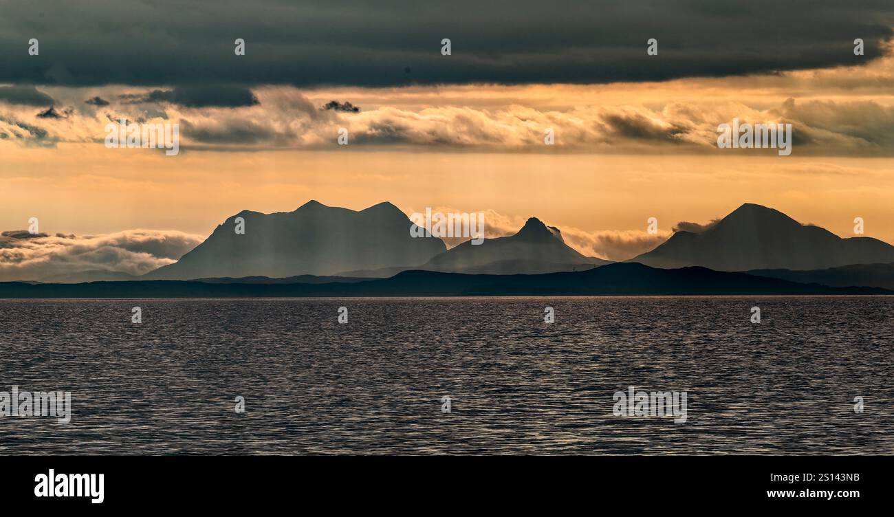 Sunrise over the Assynt mountains - taken from the Calmac ferry as it ...