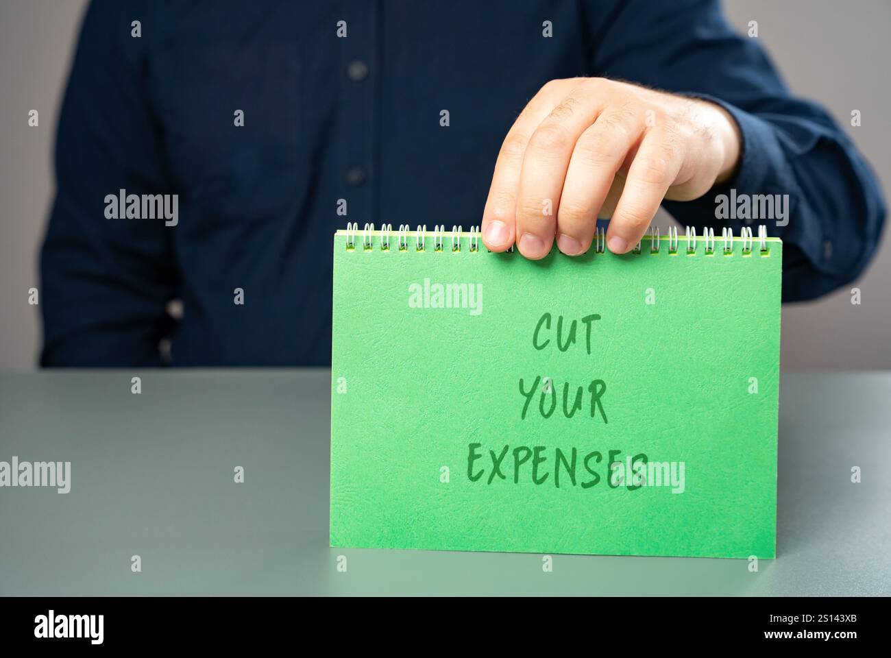 Notes Cut your expenses. Money management and budget planning. A man ...