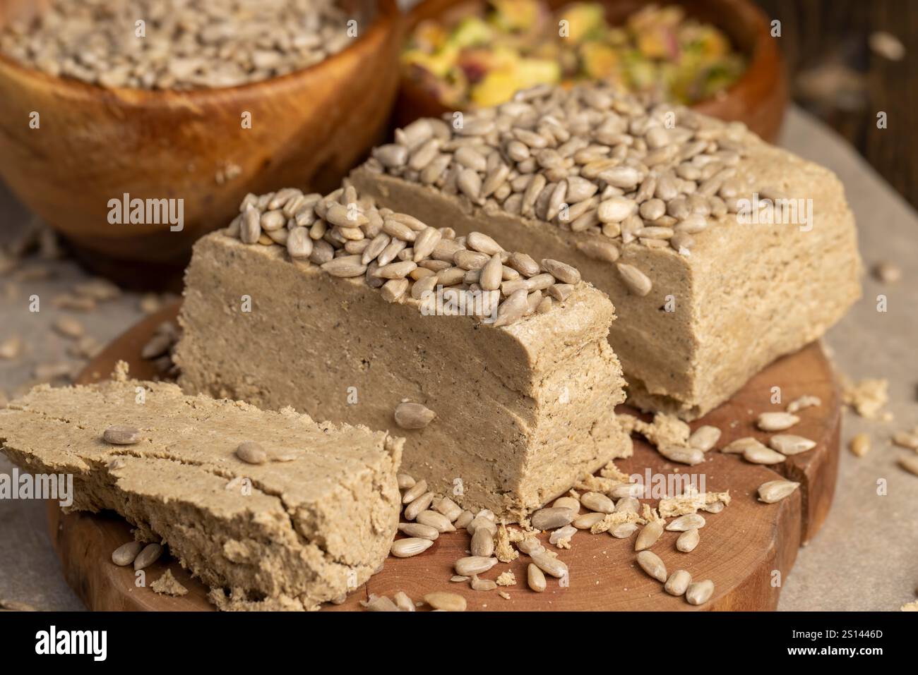cut halva from sunflower seeds closeup one solid mass, a sweet delicious dessert made from fried ...
