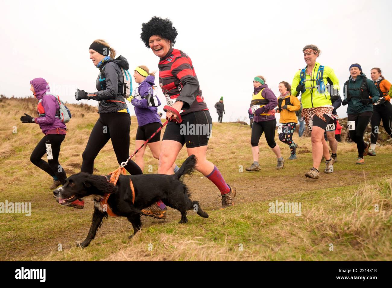 Competitors in fancy dress run across the Pennine tops near Haworth ...