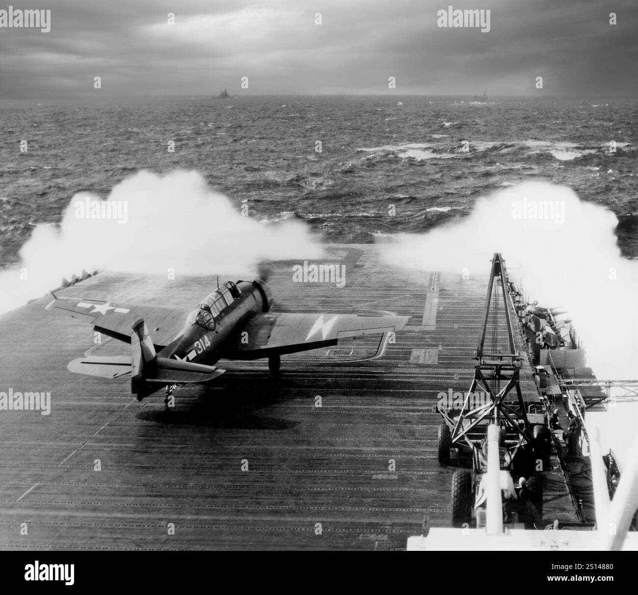 A Grumman TBF-3 Avenger talking off from the flight deck of USS Essex ...