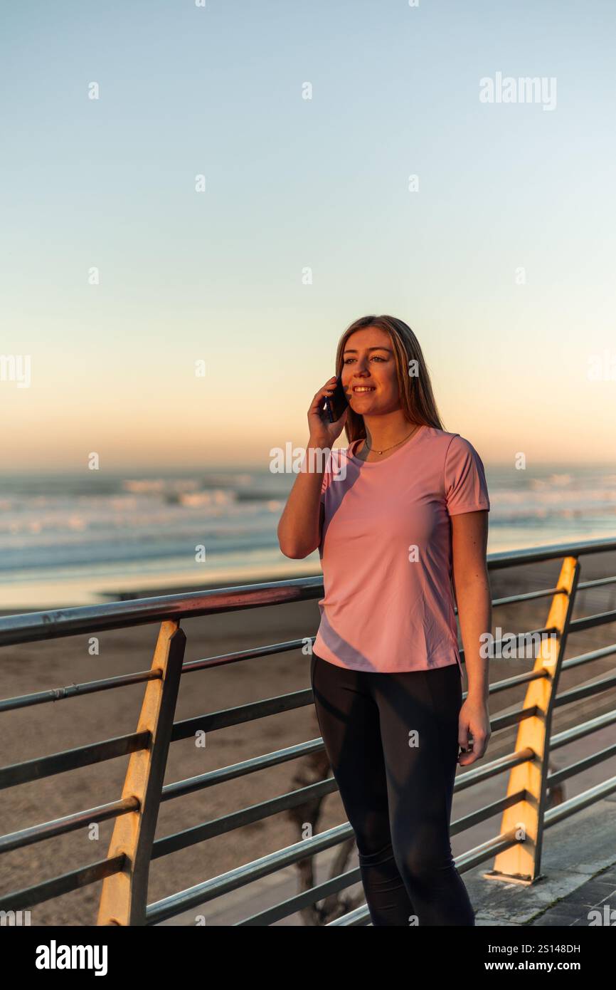 Blonde woman wearing pink shirt hi-res stock photography and images - Alamy