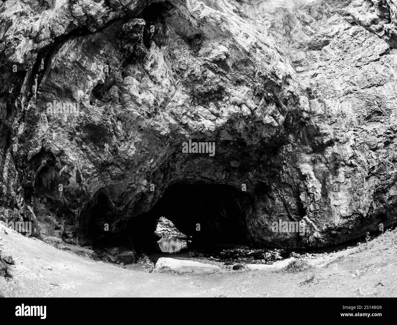 View through natural tunnel in Rakov Skocjan Valley, Slovenia. Black ...