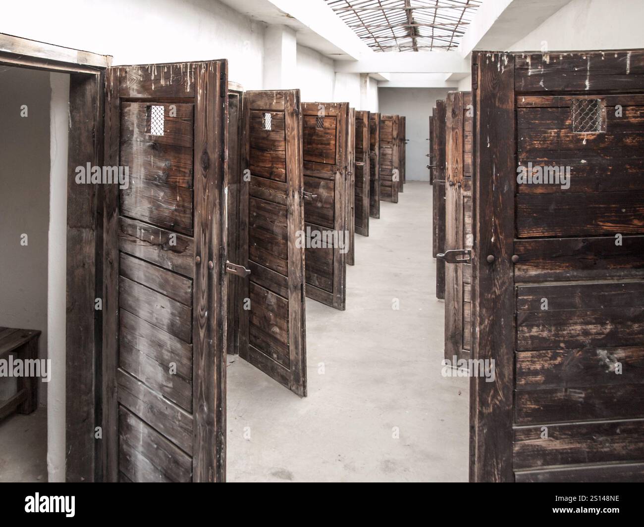Long corridor with many open prison cell doors. Vintage image Stock ...
