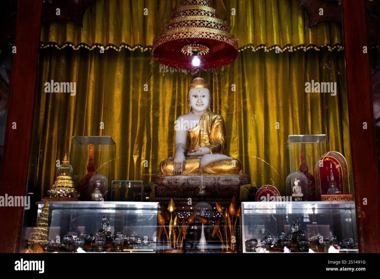 Ancient white jade buddha statue burma style in antique pavilion hall ...